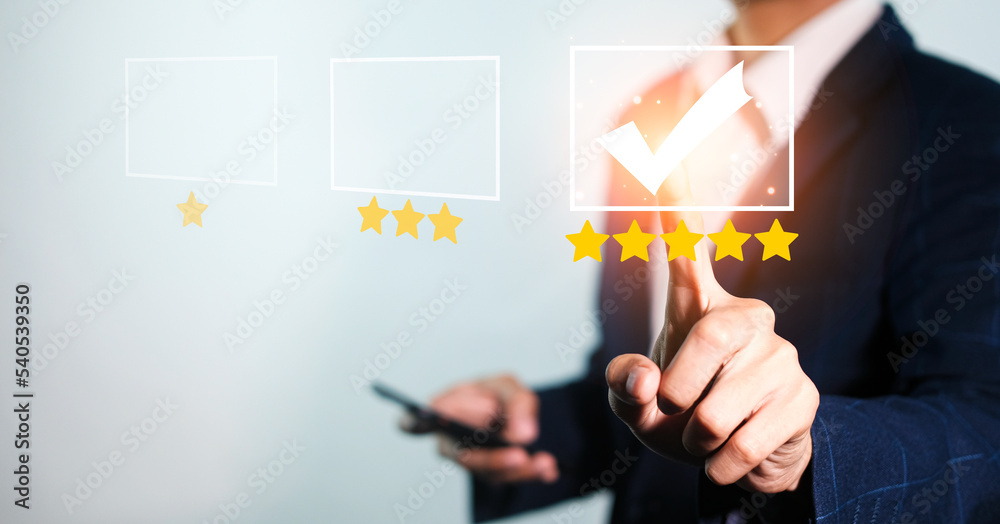 businessman touching checkmark in the box, highest satisfaction rating ...