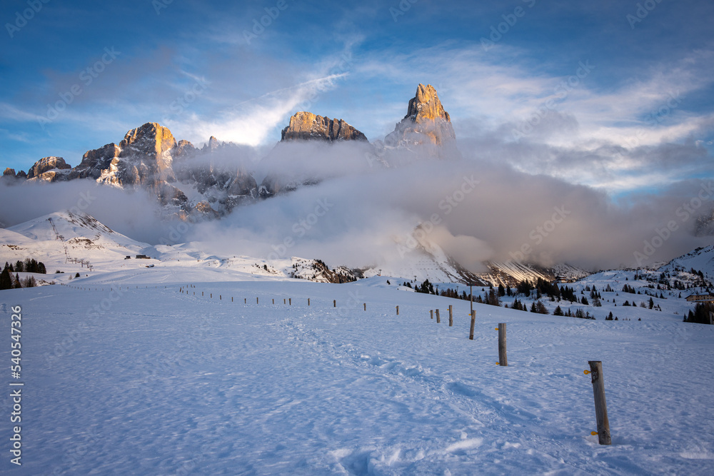 aerial view of Pale di San Martino and Passo Rolle covered with snow in ...