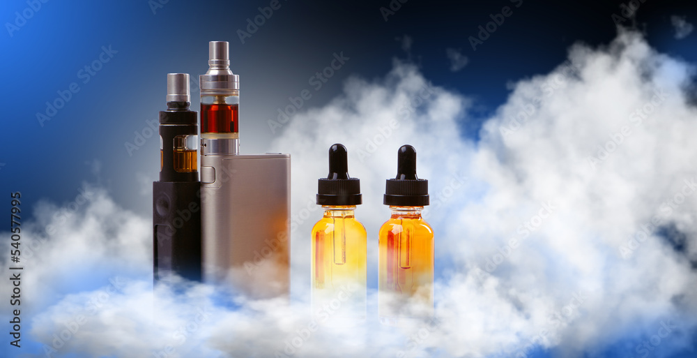 Vape kit. Modern smoking gadget. Vape kit in puffs of smoke. Liquid for ...