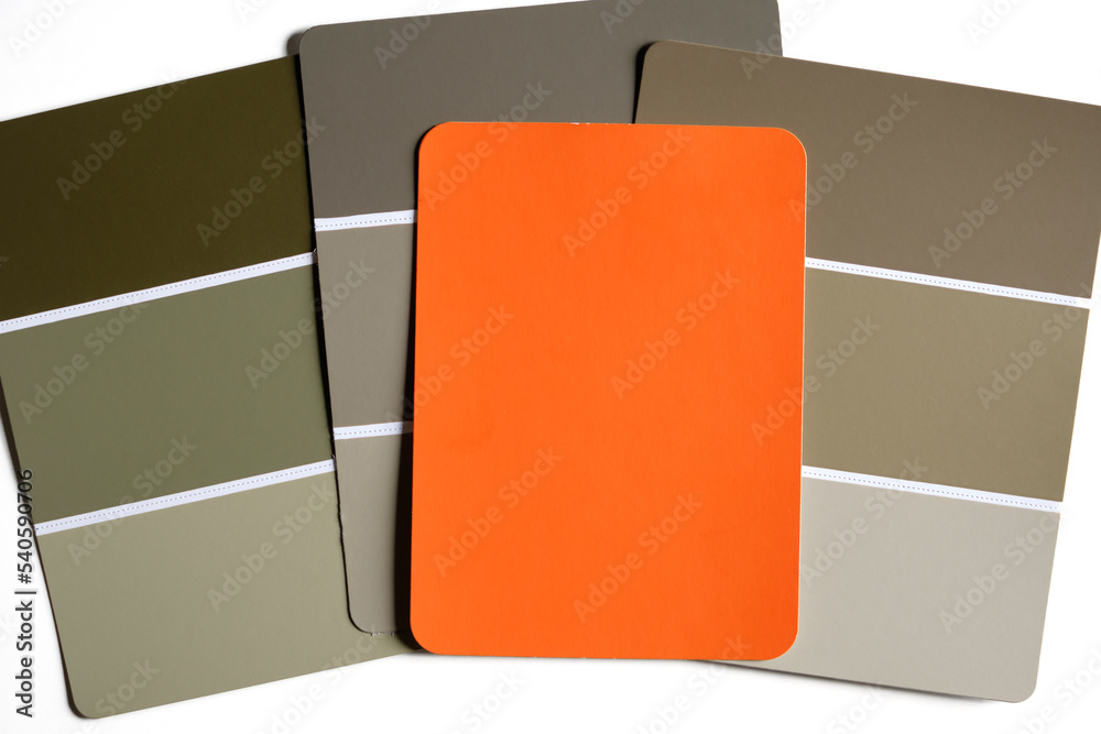 Generic color sample swatch cards scattered on a table. Swatches are in ...