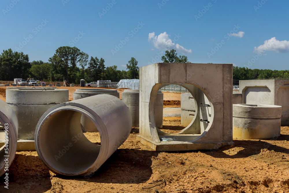 Concrete sewage pipes of large diameters on construction site to ...