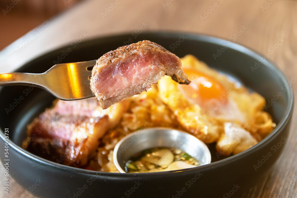 Wagyu beef with holy basil and chili fried rice served fried egg and ...
