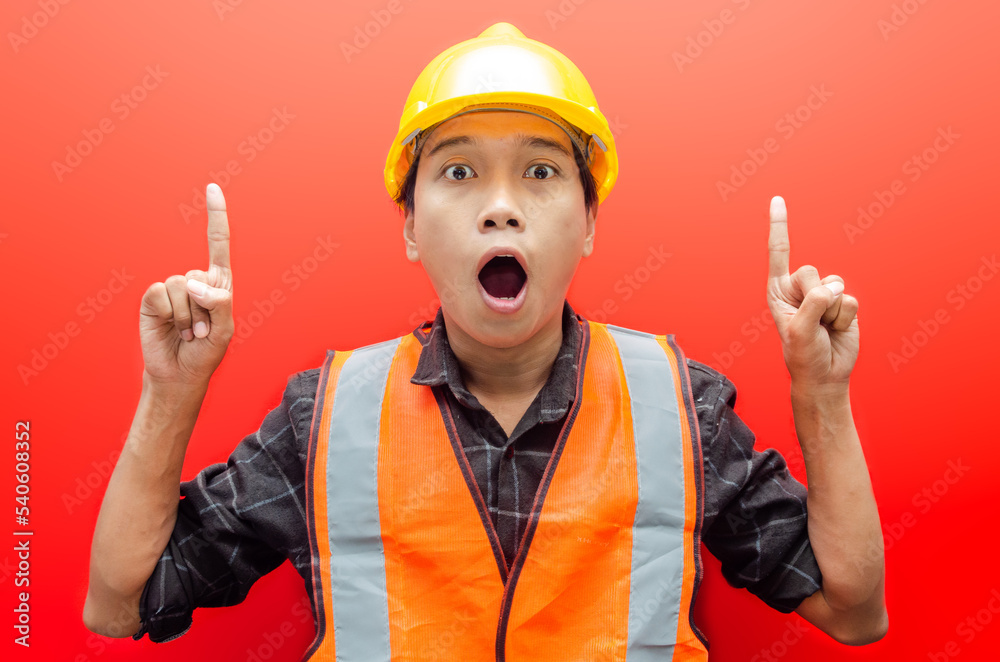 young asian consrtruction worker wearing yellow safety helmet and ...