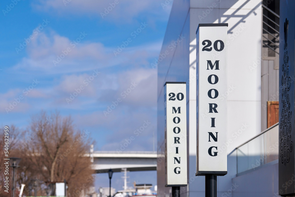Mooring pier signs in city embankment, identification signs with ...