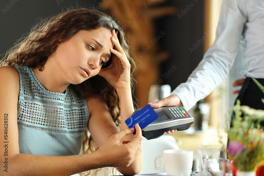 Worried customer paying expensive bill in a restaurant Stock Photo ...