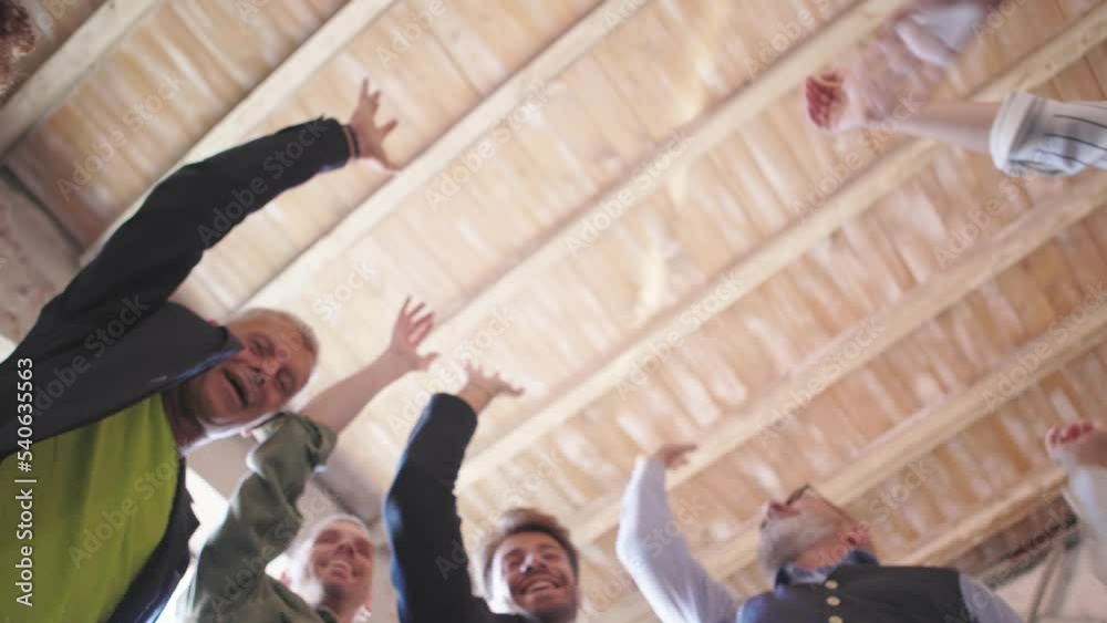 positive teamwork standing hands together - colleagues in teambuilding ...