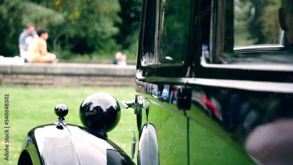Vintage classic car side view in car park vídeo de Stock | Adobe Stock