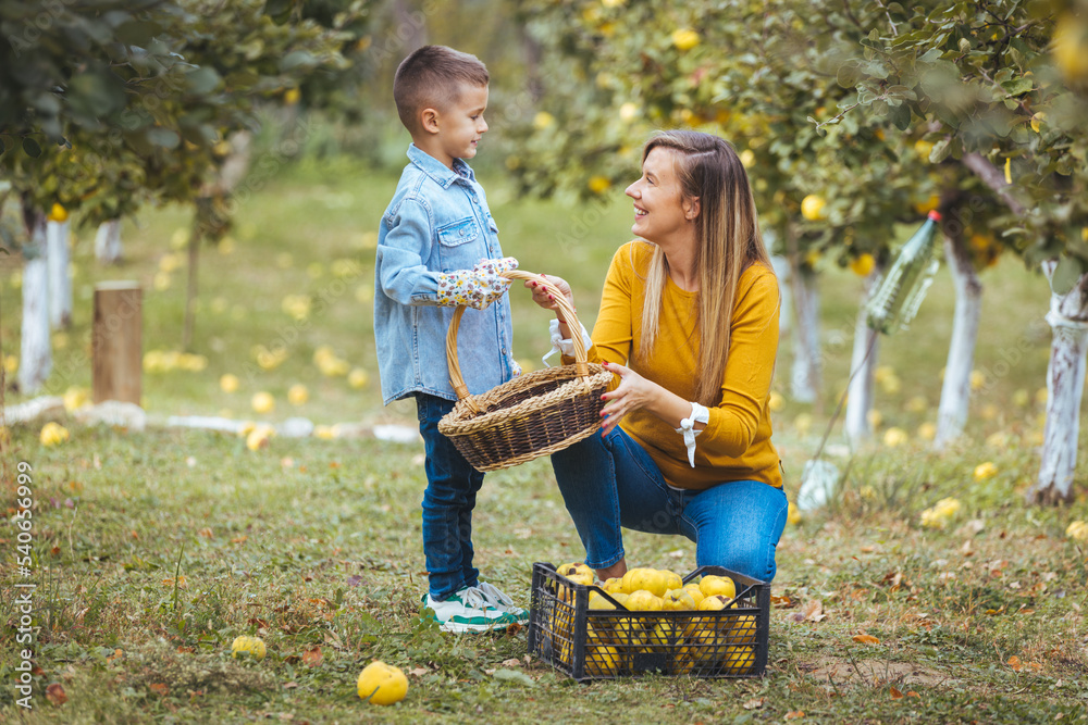 Happy family, spending time together and gardening hobby. Little son ...