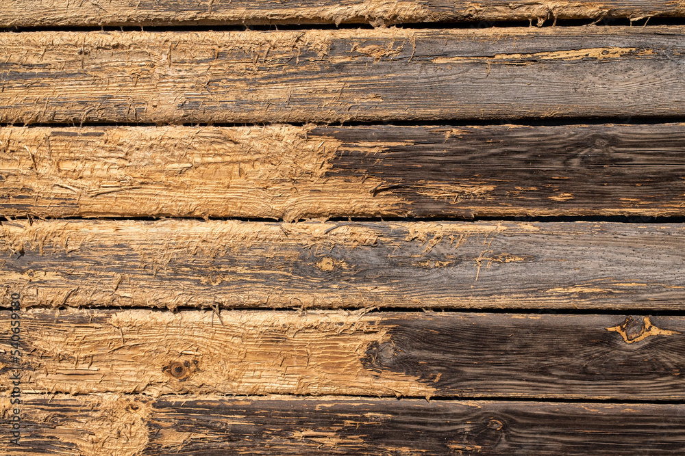 Poster Surface of old brown chipped and deteriorated wood texture ...