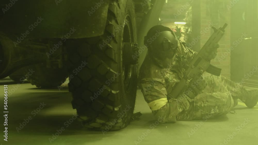 Special force soldier or swat man with modern automatic weapon walking ...