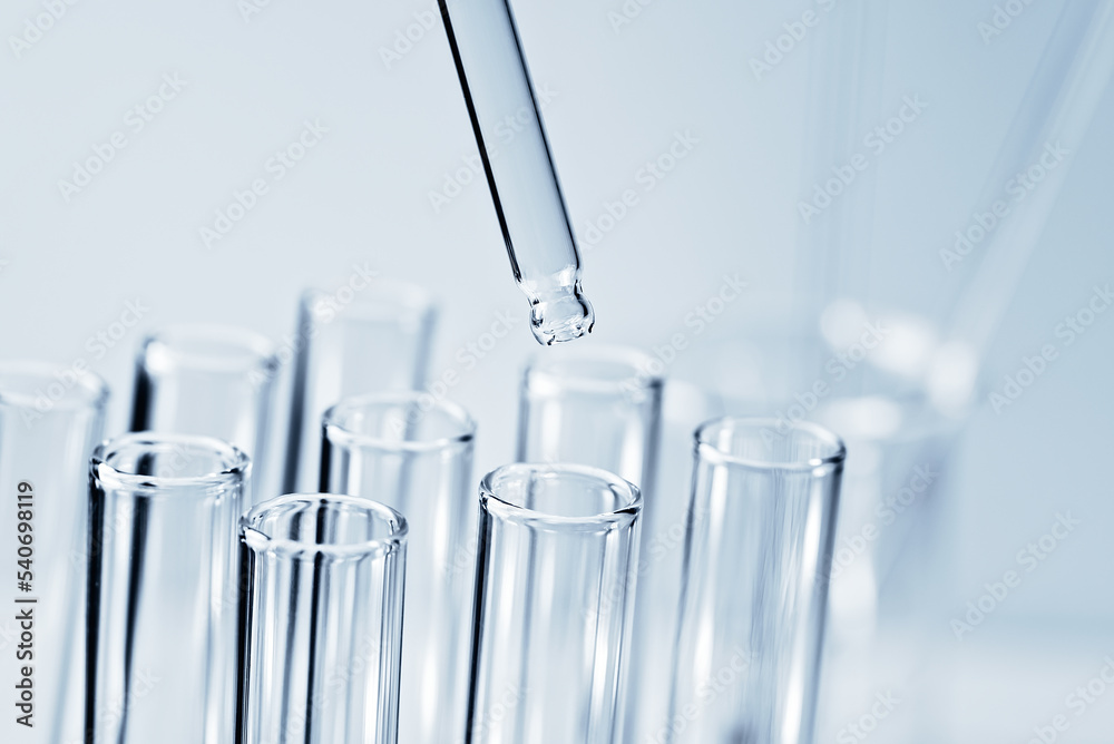 Laboratory glassware with dropper into test tube close up macro ...