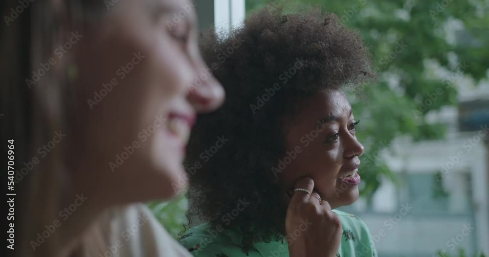 Two happy diverse women speaking in conversation. Closeup female faces ...