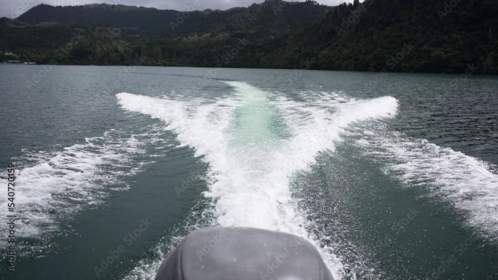 back of boat with engine running on lake tarawera, new zealand Stock ...