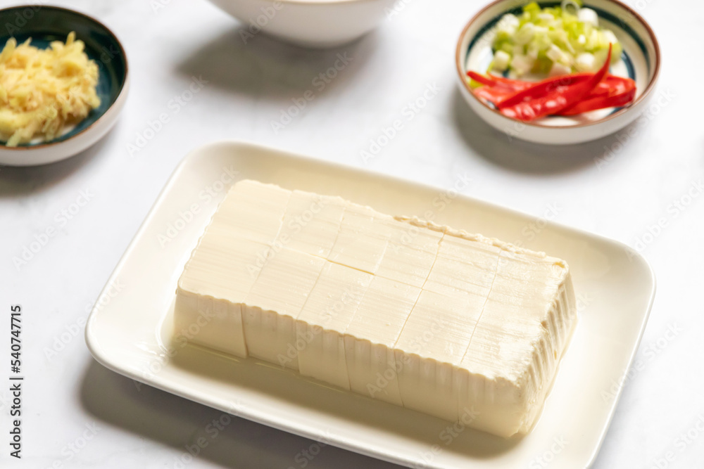 Vegan silken tofu is served hot or cold with a savory soy sauce ...