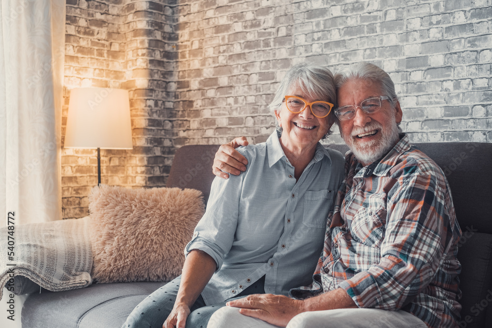Cute and beautiful couple of old people smiling and looking at the ...