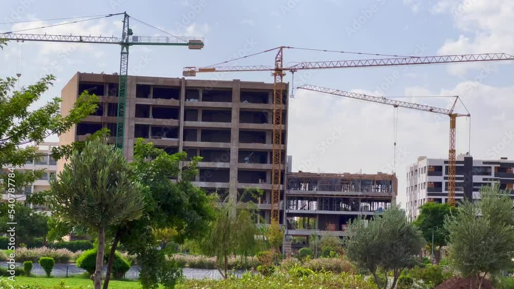 Residential buildings under construction around a public park Stock ...