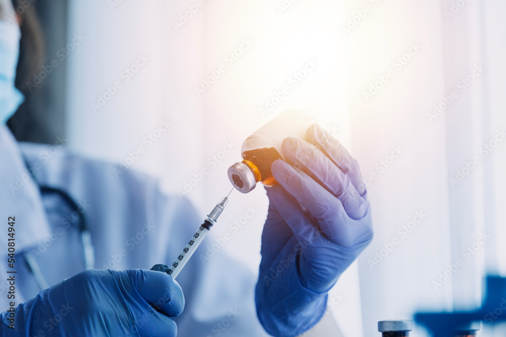 biochemical research scientist team working with microscope for ...