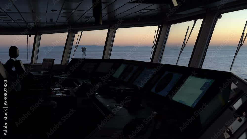 Ship's bridge inside. Side view of control panel screens of wheelhouse ...