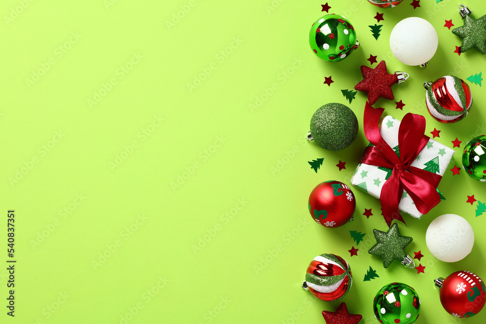 Red and green Christmas decorations on light green background ...