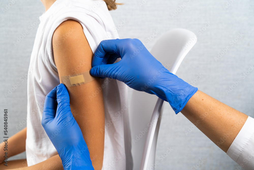 vaccination of children, a little boy at a doctor's appointment, an ...