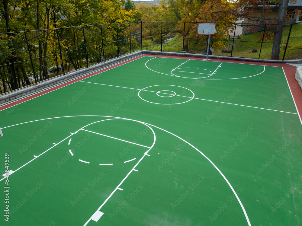 Aerial photo of a green and red outdoor basketball court at school ...