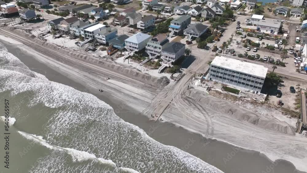Clean up after Hurricane Ian storm surge causes beach erosion and ...