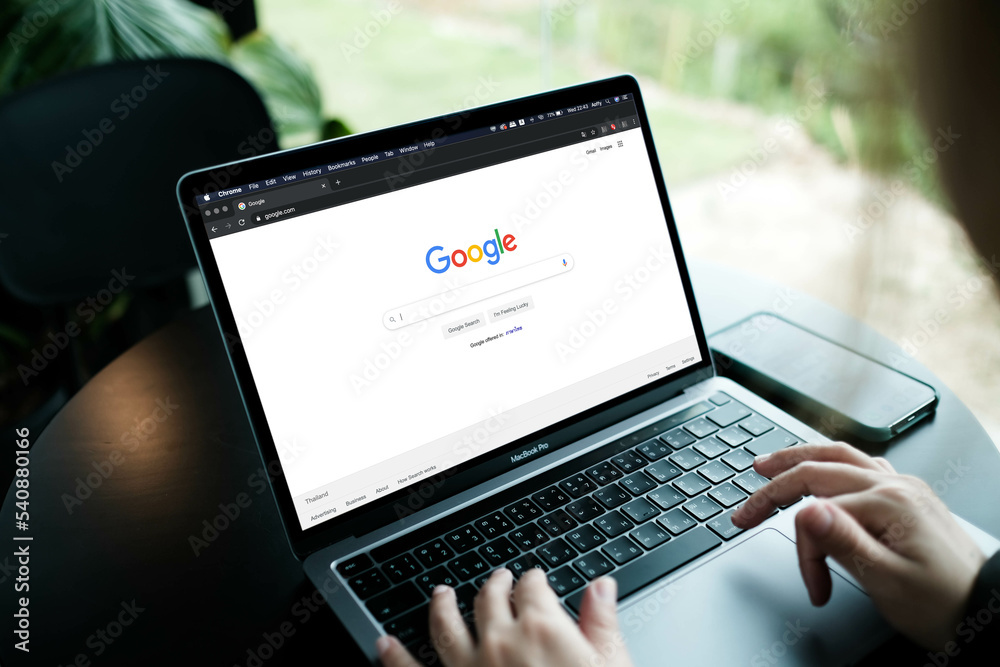 Bangkok. Thailand. October 25,2022: A woman is typing on Google search ...