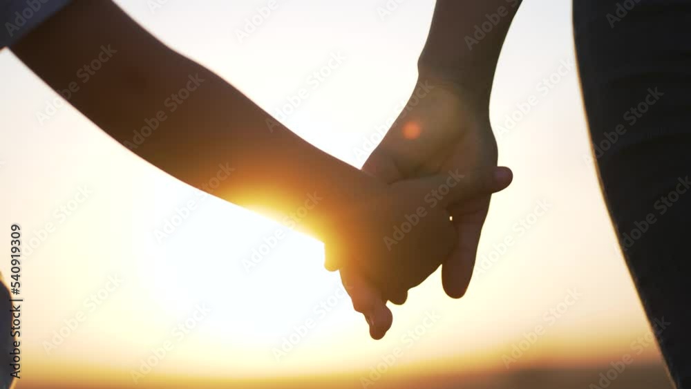 happy family. Mom lends helping hand to her daughter girl in nature in ...