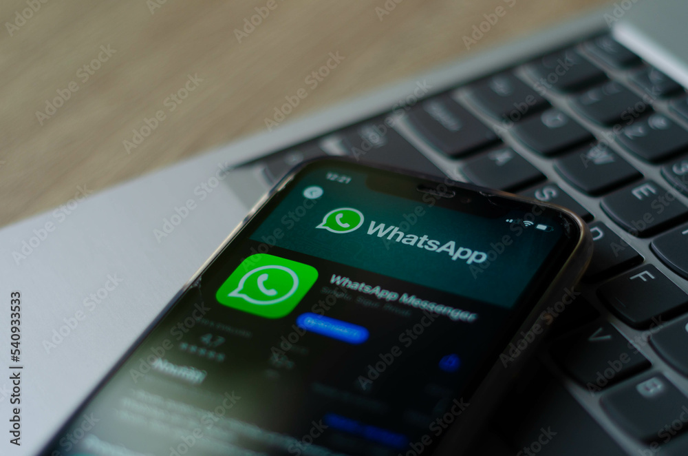 Hands Holding Mobile Smart Phone Device With Whatsapp Company App Logo ...