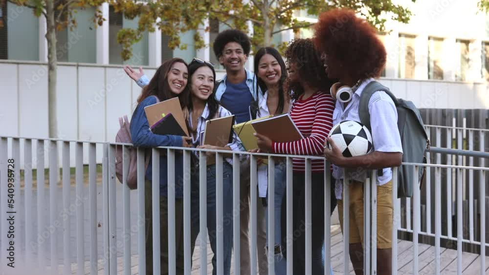 Young diverse people, multiracial students having fun outdoor laughing ...
