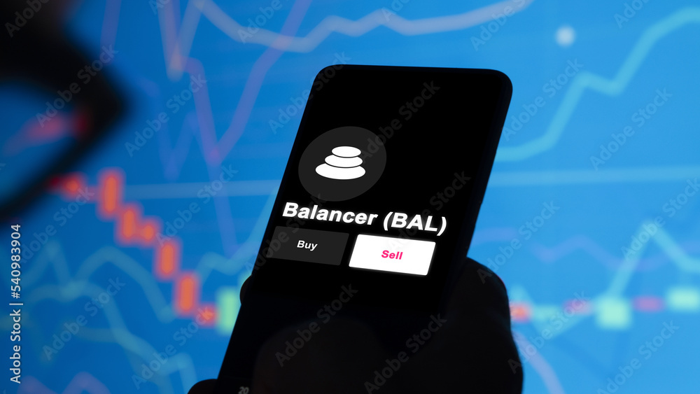 An investor's analyzing the Balancer BAL coin on screen. A phone shows ...