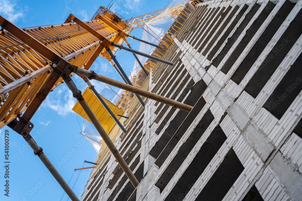 Crane construction site working background. Concrete residential ...