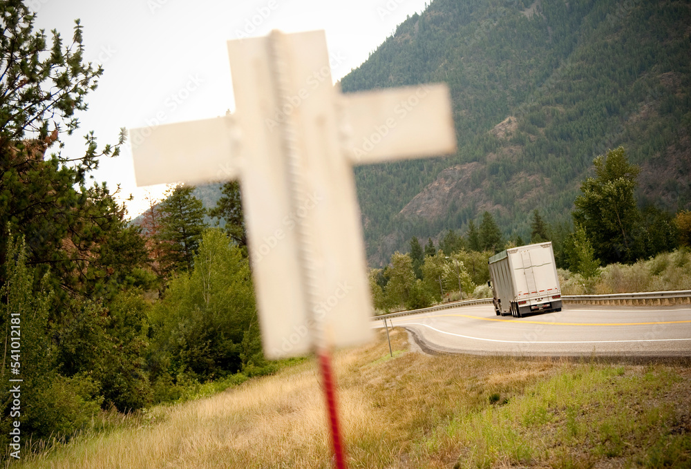 A white cross signifying a death along a dangerous highway. Stock Photo ...
