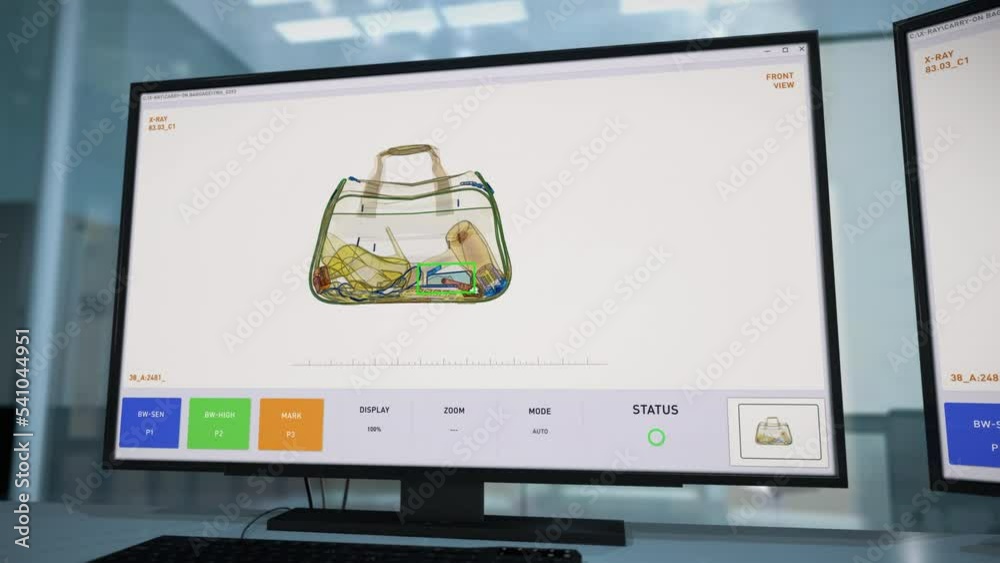 Visual of the modern x-ray scanning the suitcases at the airport ...