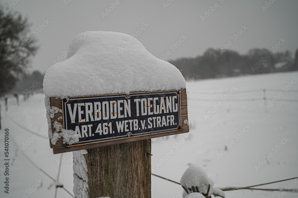 Wooden sign with a forbidden entry text in a snowy field Stock Photo ...