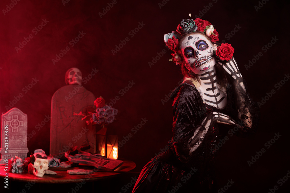 Goddess of death wearing holy costume and flowers crown, holding roses ...