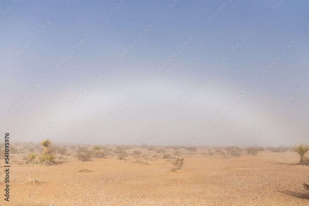 Winter weather phenomenon fog bow or white rainbow caused by sunlight ...