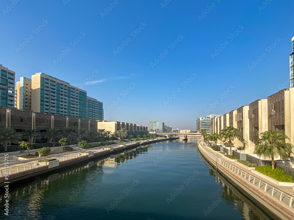 The canal and buildings in the Al Raha Beach neighbourhood in Abu Dhabi ...