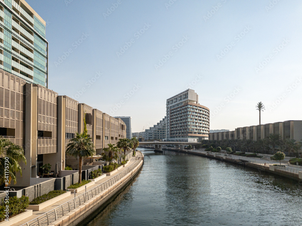 The canal and buildings in the Al Raha Beach neighbourhood in Abu Dhabi ...