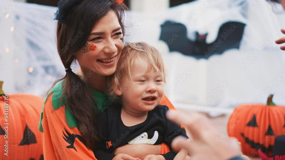Happy multiethnic family - mother, father and little son celebrate ...