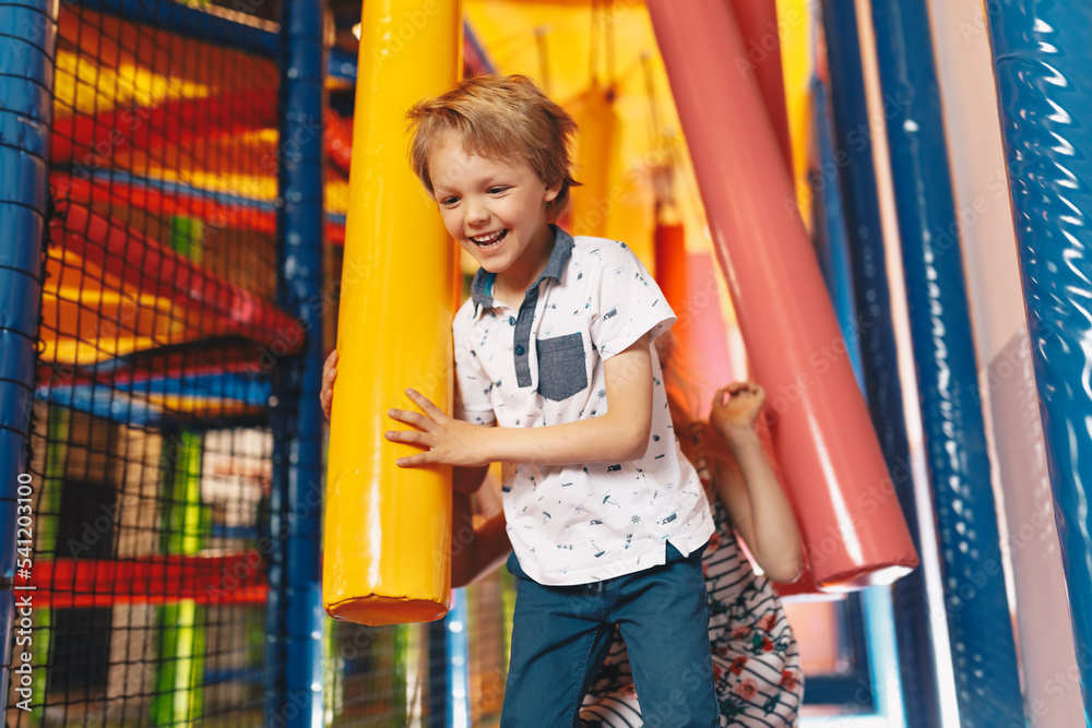 Happy Kids Having Fun at Play Centre. Schoolboy Running on Jumping ...