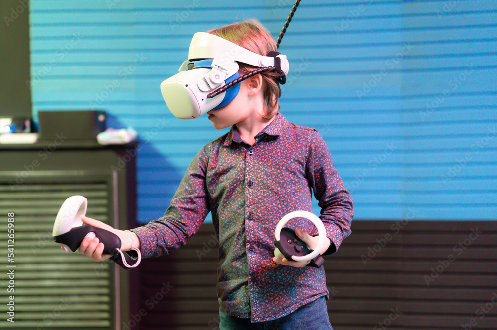 vr game and virtual reality. kid boy gamer six years old fun playing on ...