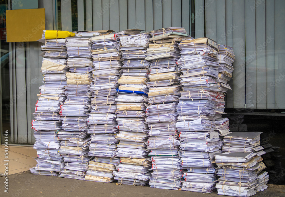 A bunch of old documents and paperwork on street infront of state ...