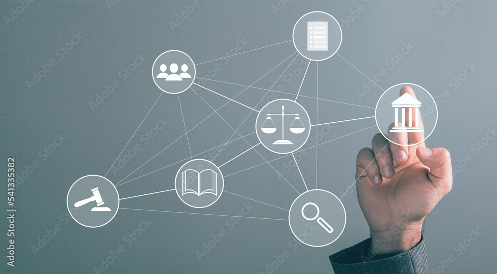 Icons of scales and justice on the screen. Stock Photo | Adobe Stock