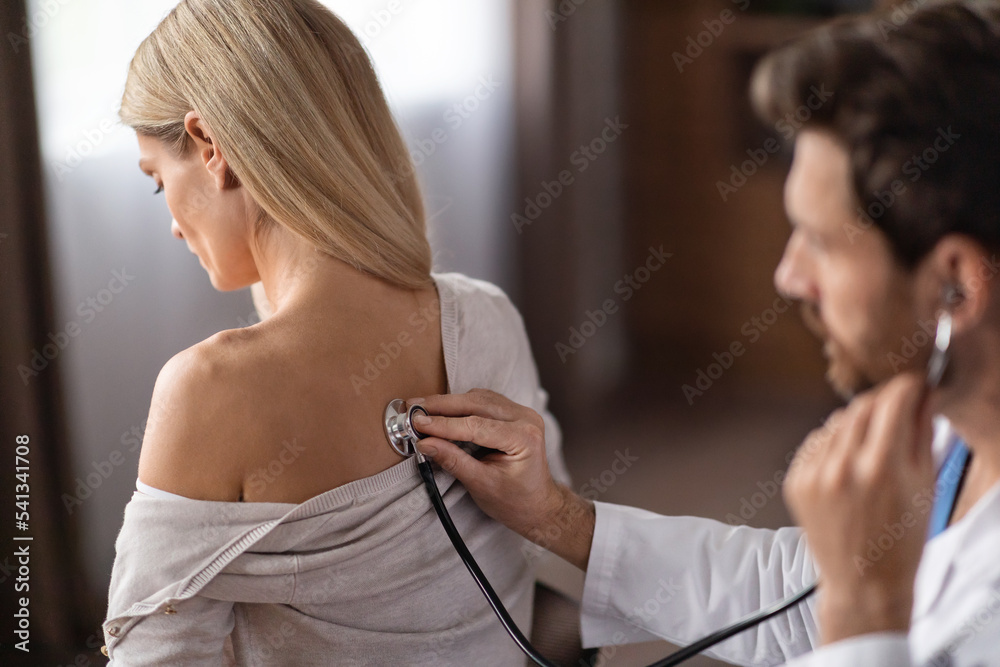 Medical Check Up. Male Doctor Using Stethoscope For Checking Female ...