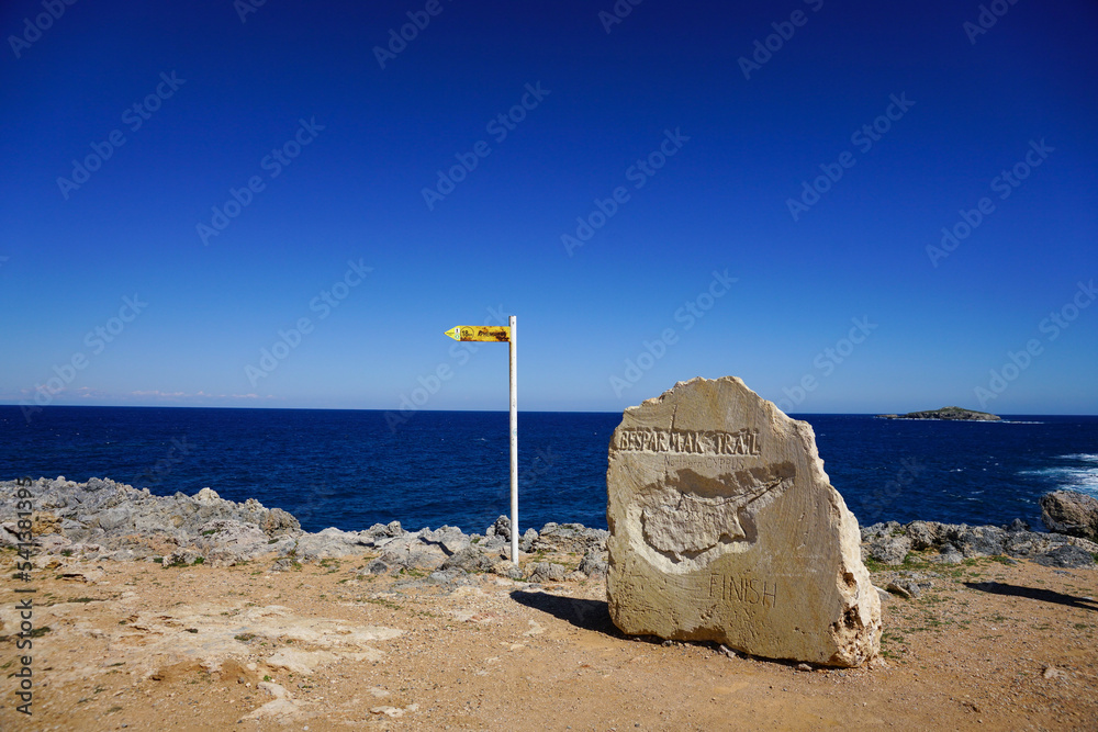 northern cyprus karpaz peninsula, flag at the farthest point and a rock ...