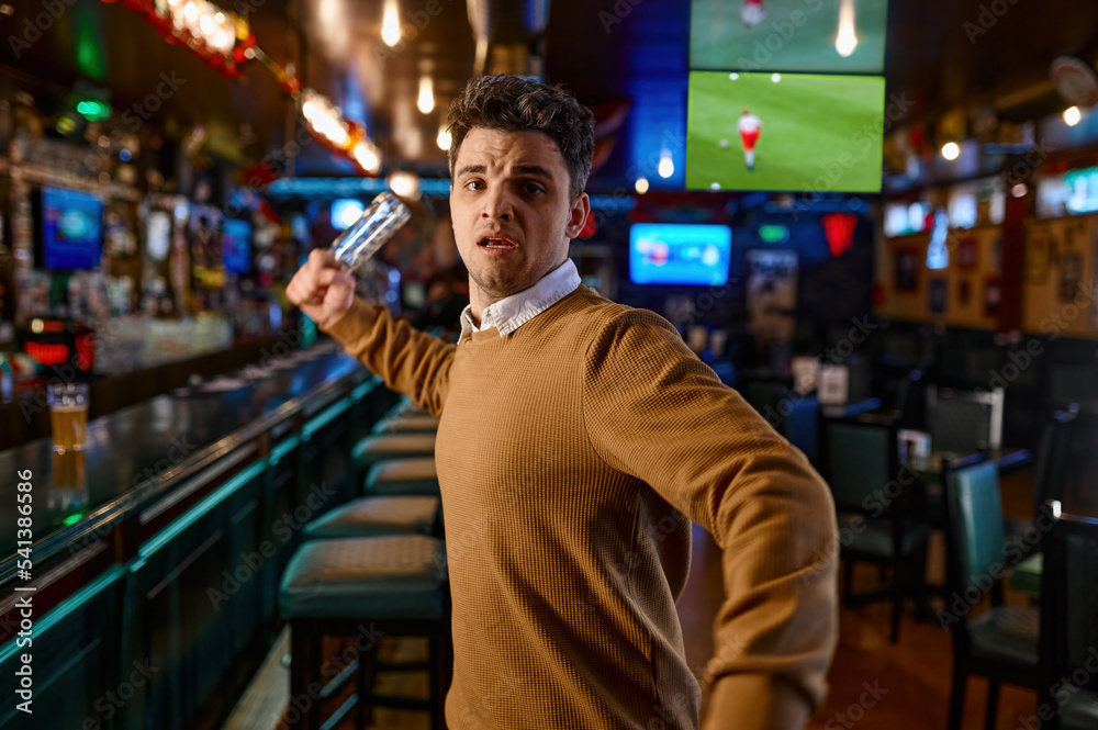 Angry man attacking with empty beer bottle Stock Photo | Adobe Stock