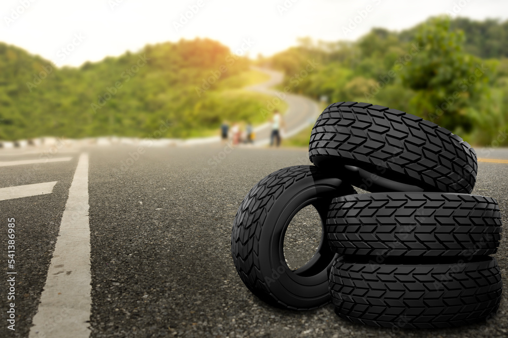 Black rubber tyre set with curve on the hill is background.Safe travel ...