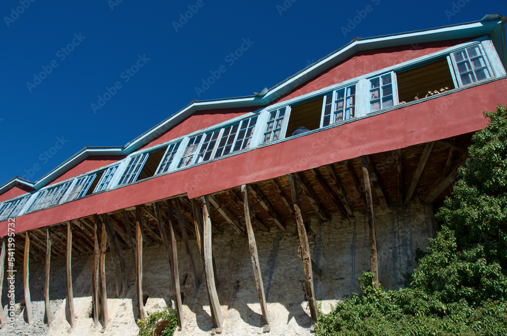 Traditional architecture with wooden and stone walls and balcony of ...