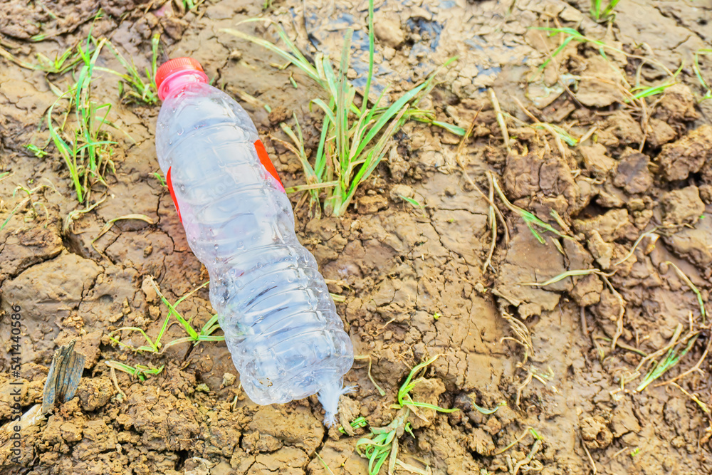 plastic bottle of drinking water on cracked wet ground Stock Photo ...
